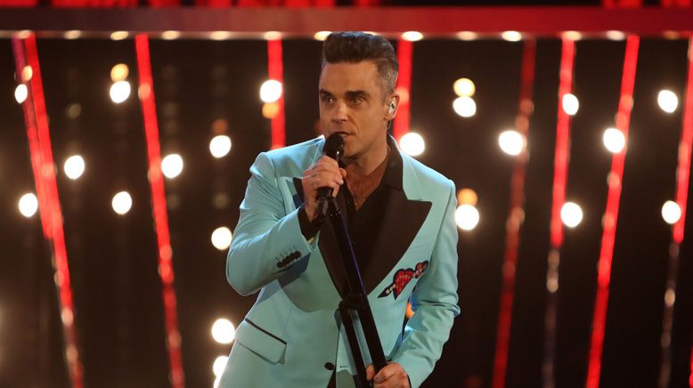Robbie Williams has started singing in French and it's too much to ...