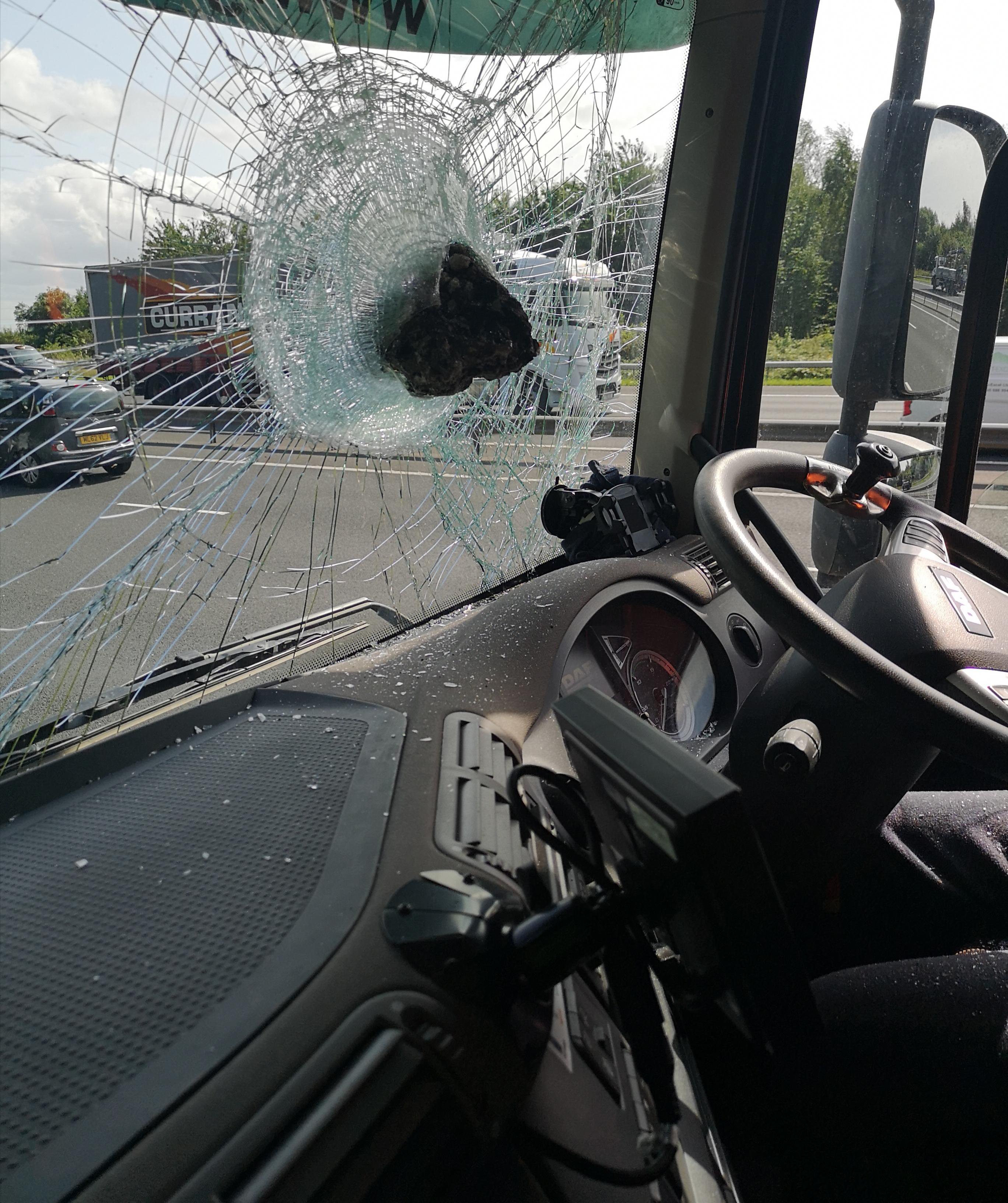 Lorry driver extremely lucky after rock thrown through windscreen