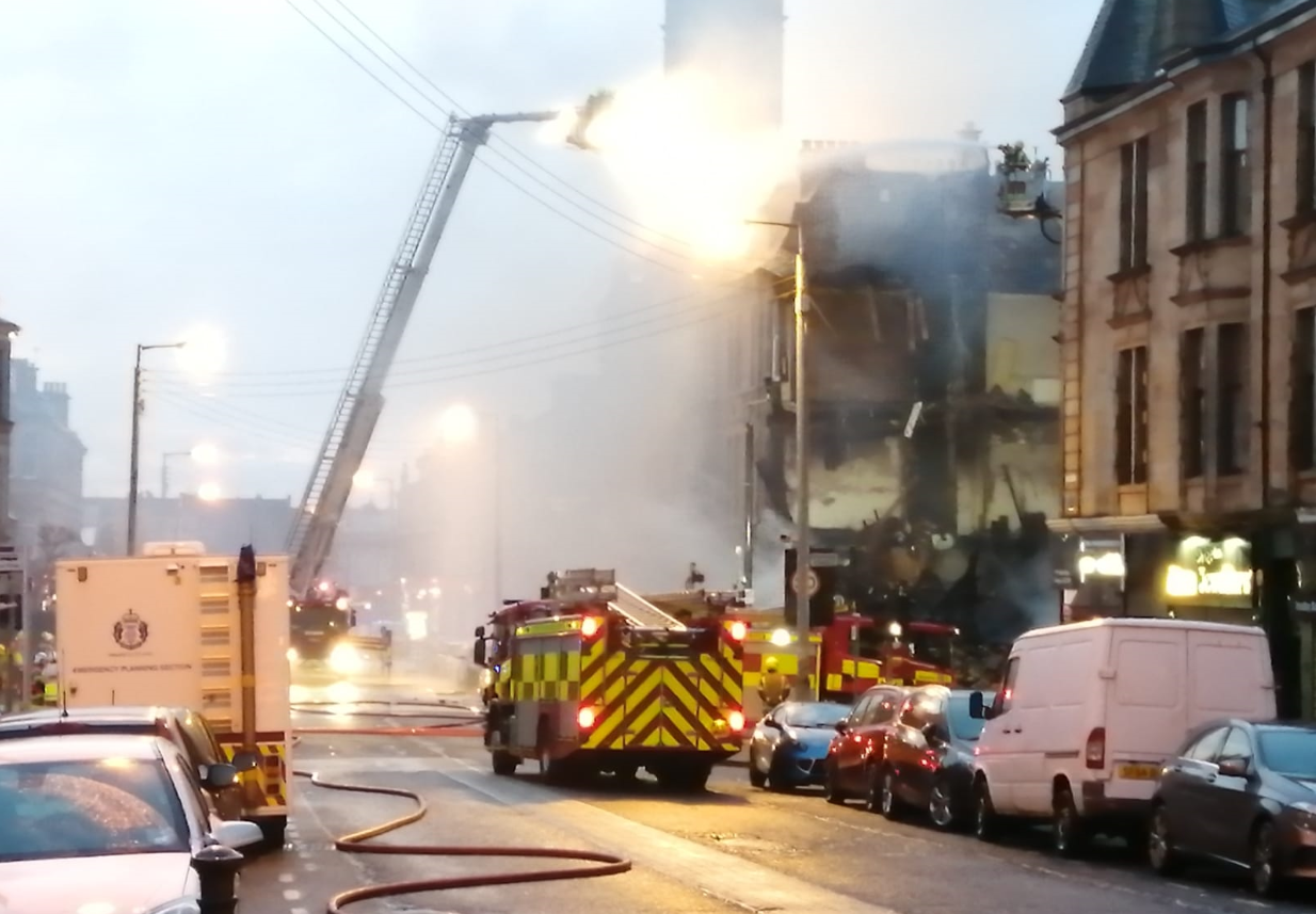 Fire crews have worked through the night tackling a blaze in a tenement ...