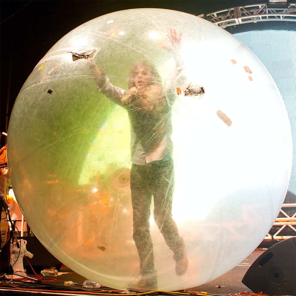 The Flaming Lips perform gig with audience in inflatable bubbles