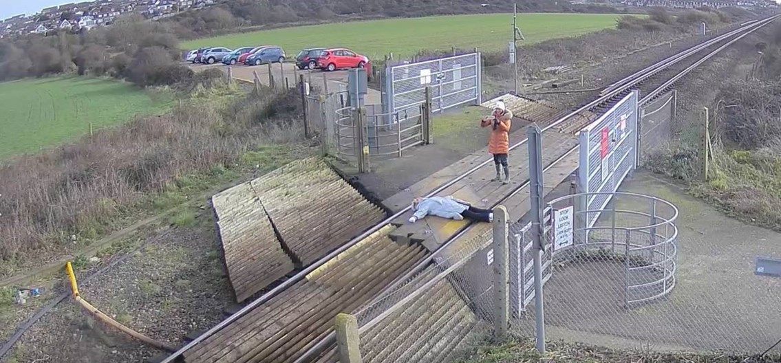 Women branded 'unthinkably stupid' after photo on level crossing