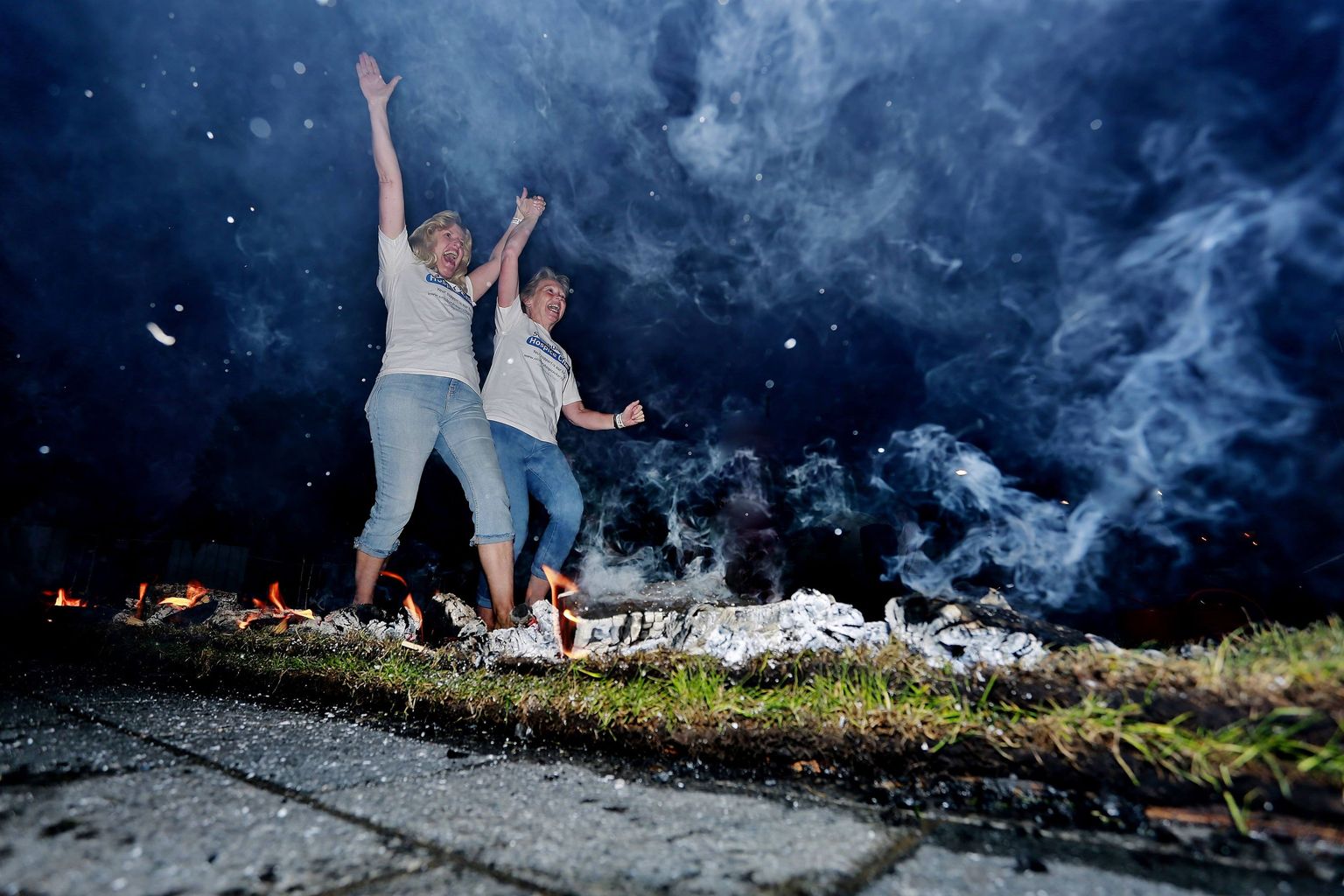 Thrill seekers took to hot coals on Friday night to raise thousands for ...