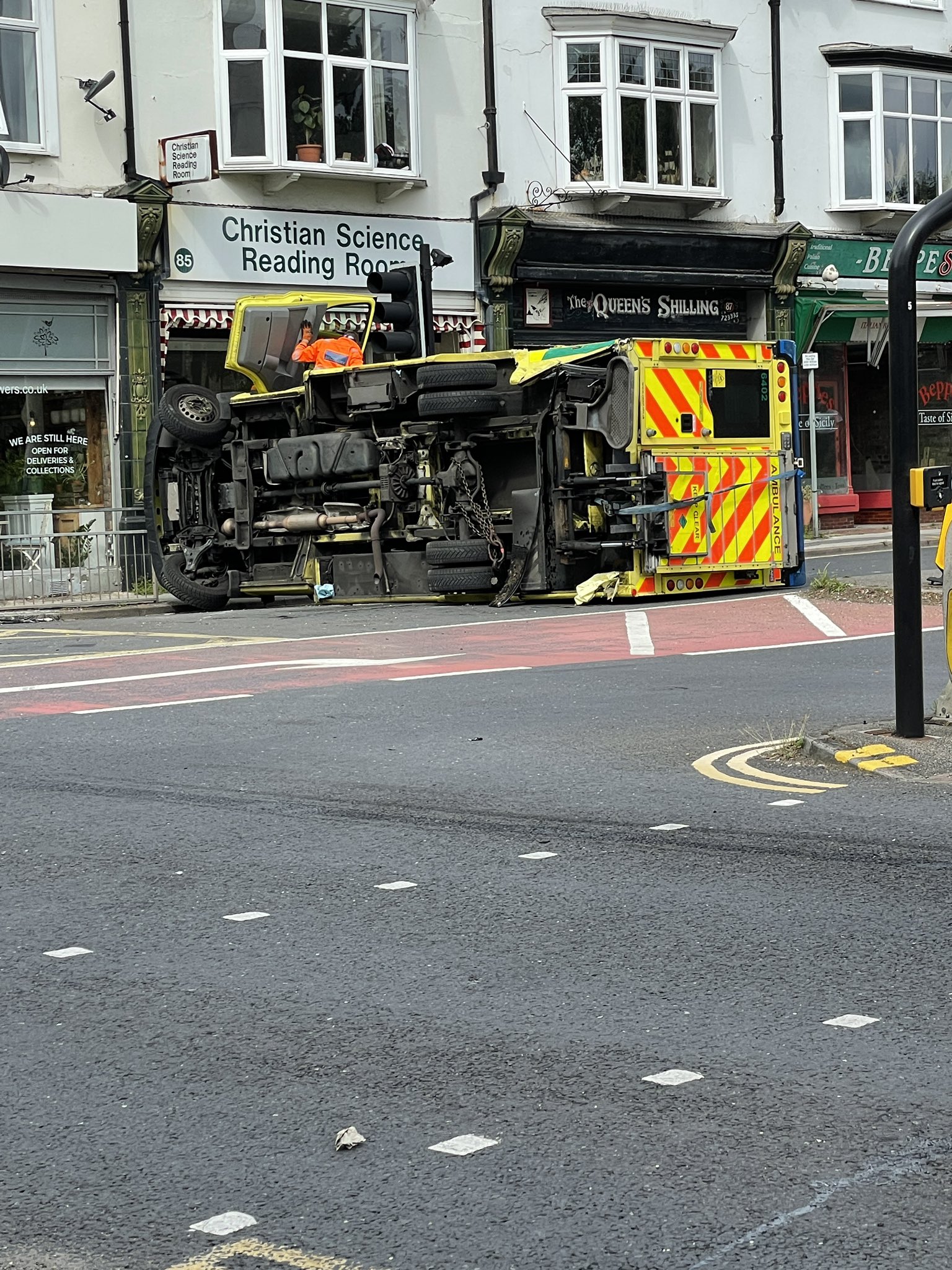 Ambulance rolls onto its side in crash with car | News - Greatest Hits ...