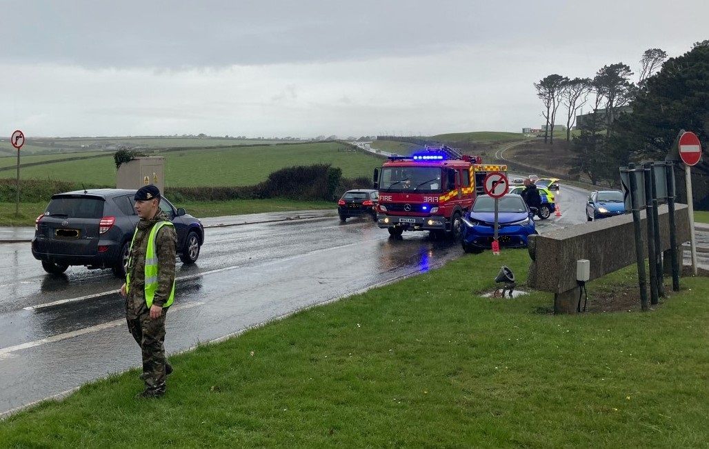 Military personnel rush to help after two cars crash outside RNAS Culdrose
