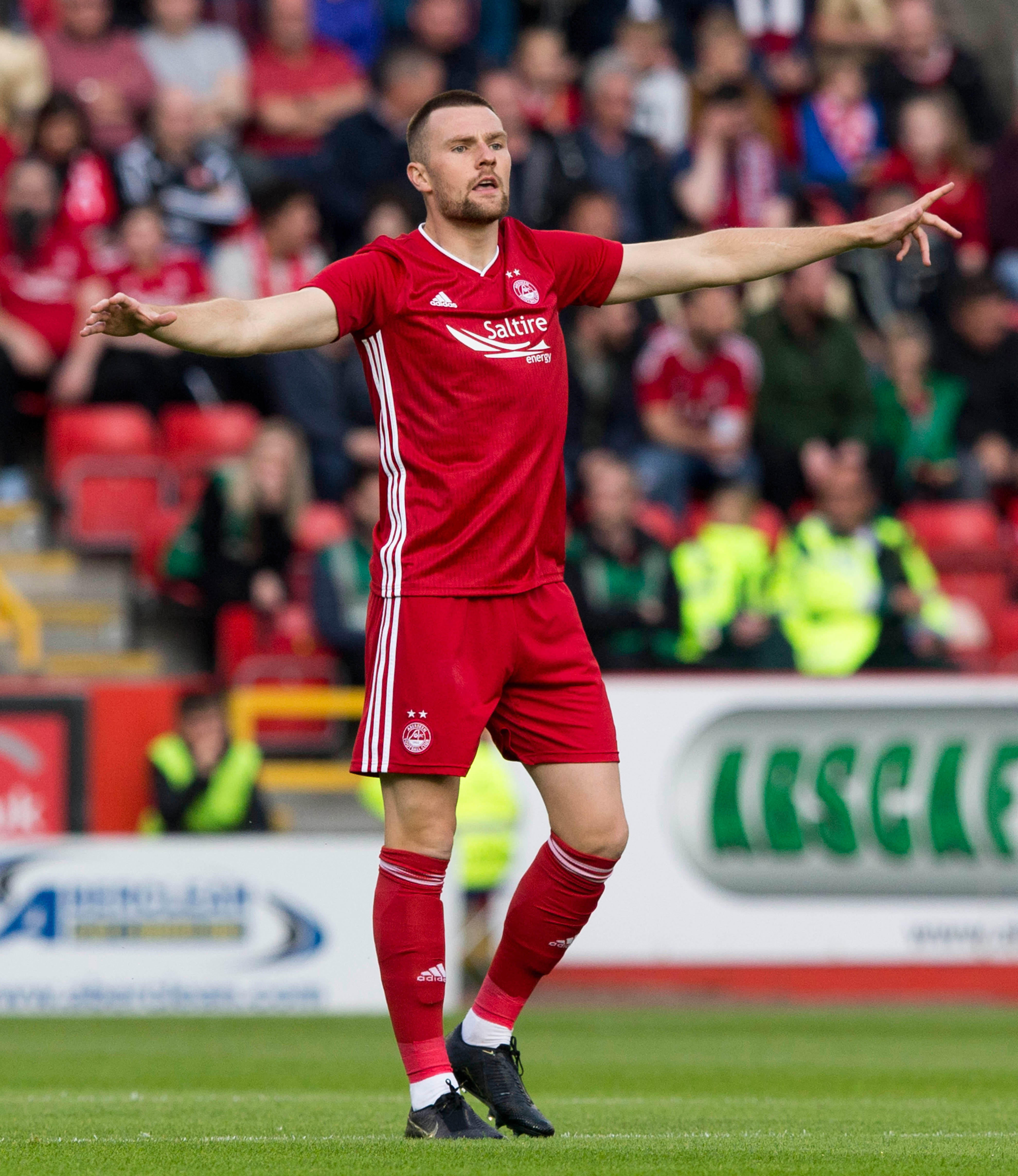 Aberdeen terminate Mikey Devlin's contract.
