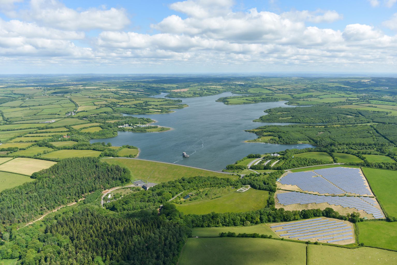 Two bodies have been recovered after a boat capsized on a Devon lake