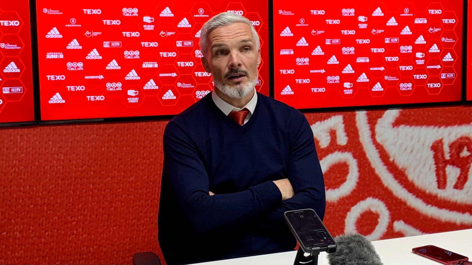 Jim Goodwin is to stay on as Aberdeen manager - for the time being.
