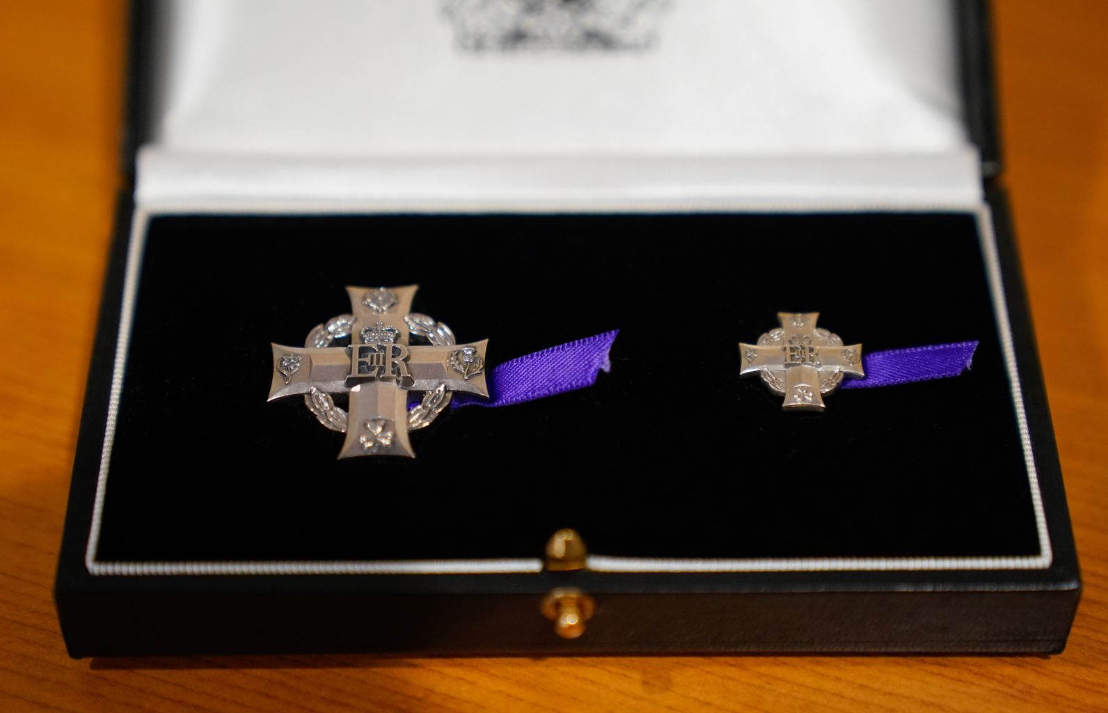 Families of soldiers who died serving Britain, presented with Elizabeth ...