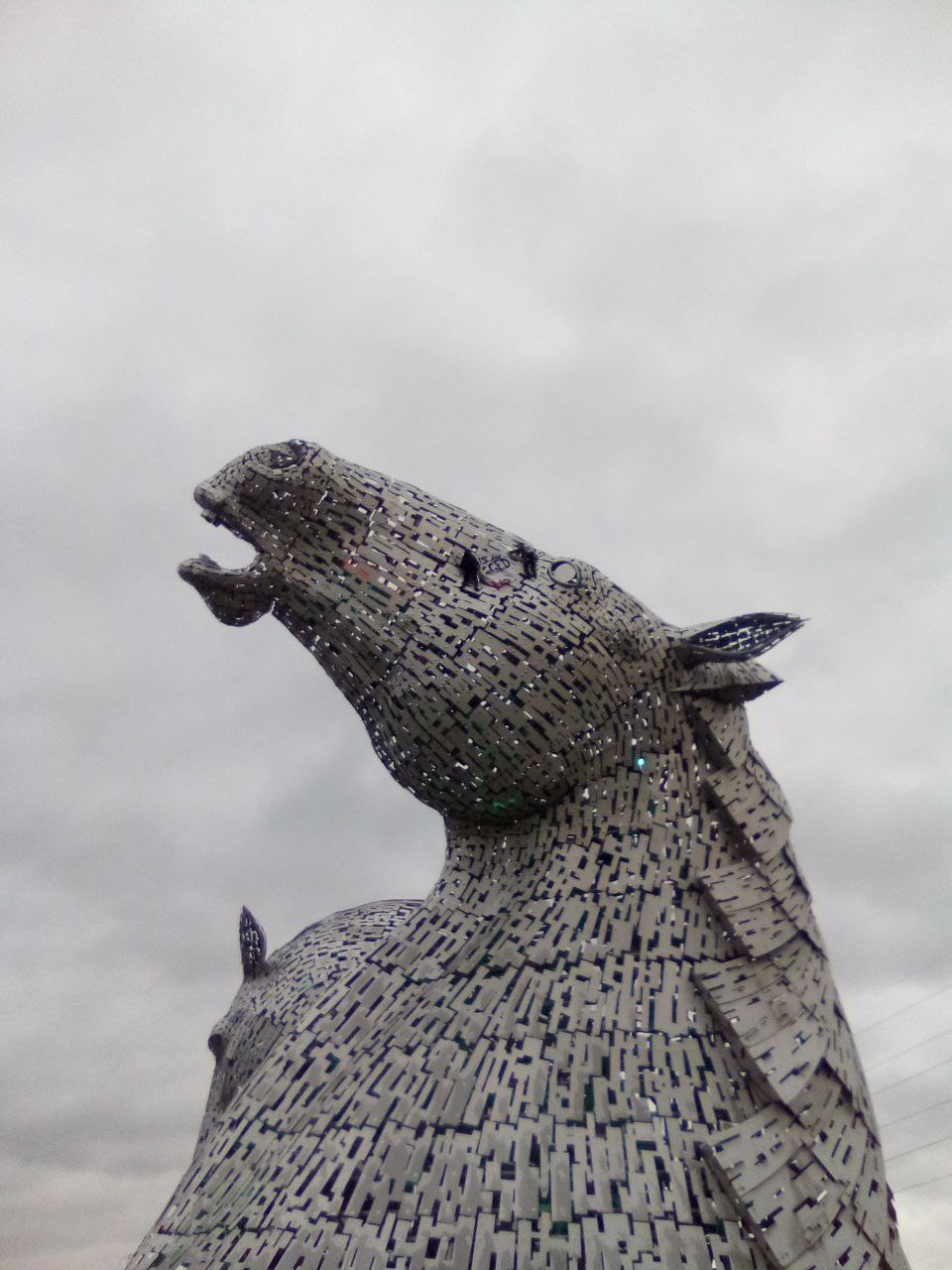 Activists climb the Kelpies in climate change protest