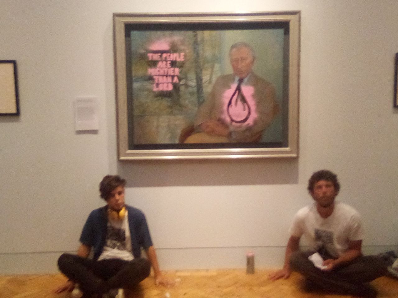 Climate protestors spray paint portrait of King Charles in National ...