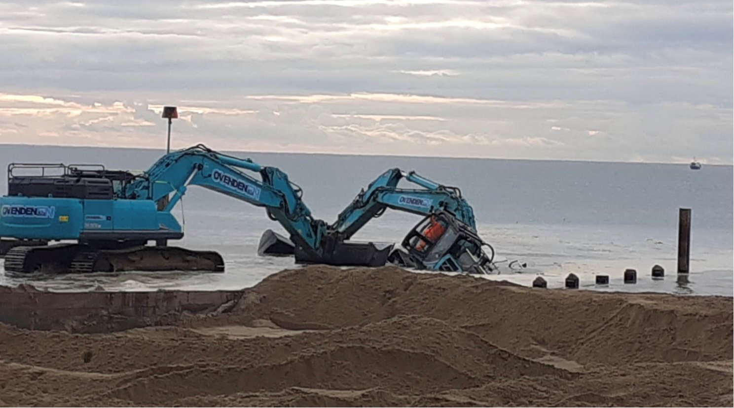 Driver rescued from excavator stuck in sand on Bournemouth beach | News ...