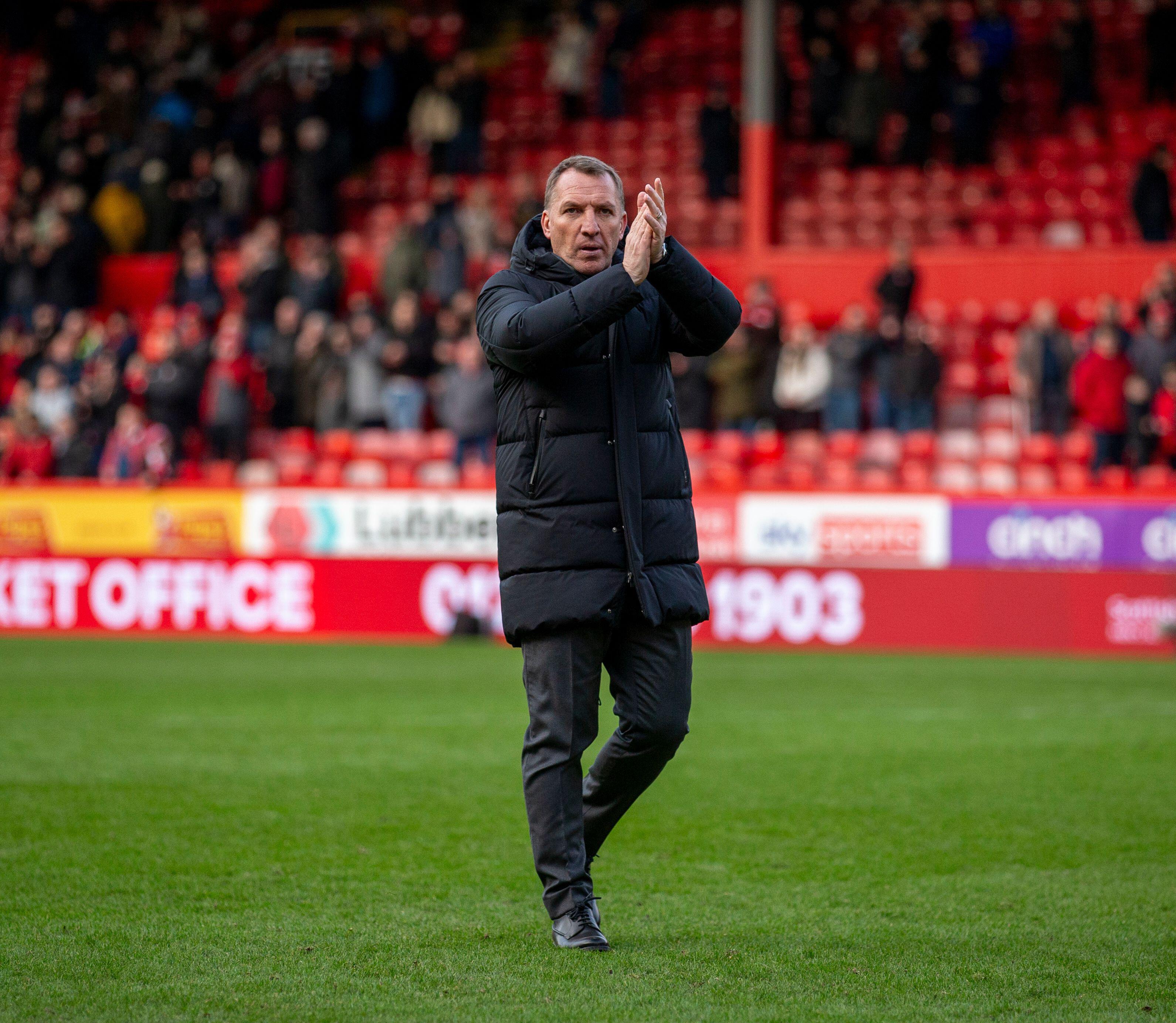 Celtic manager Brendan Rodgers reacts to fans' protest.