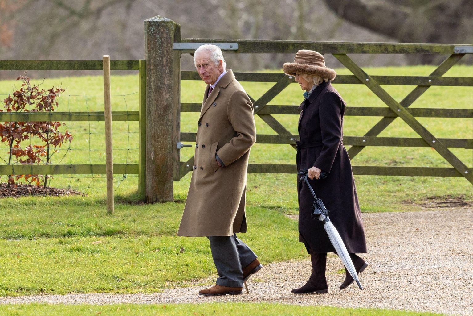 King smiles and waves as he attends Norfolk church following Harry ...