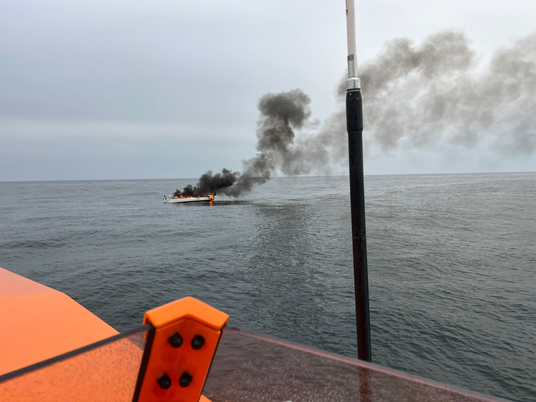 Lifeboats rescue man from drowning as yacht catches fire on Tenby coast