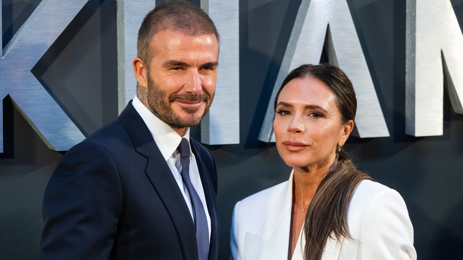 David and Victoria Beckham wear iconic purple wedding outfits 25 years on