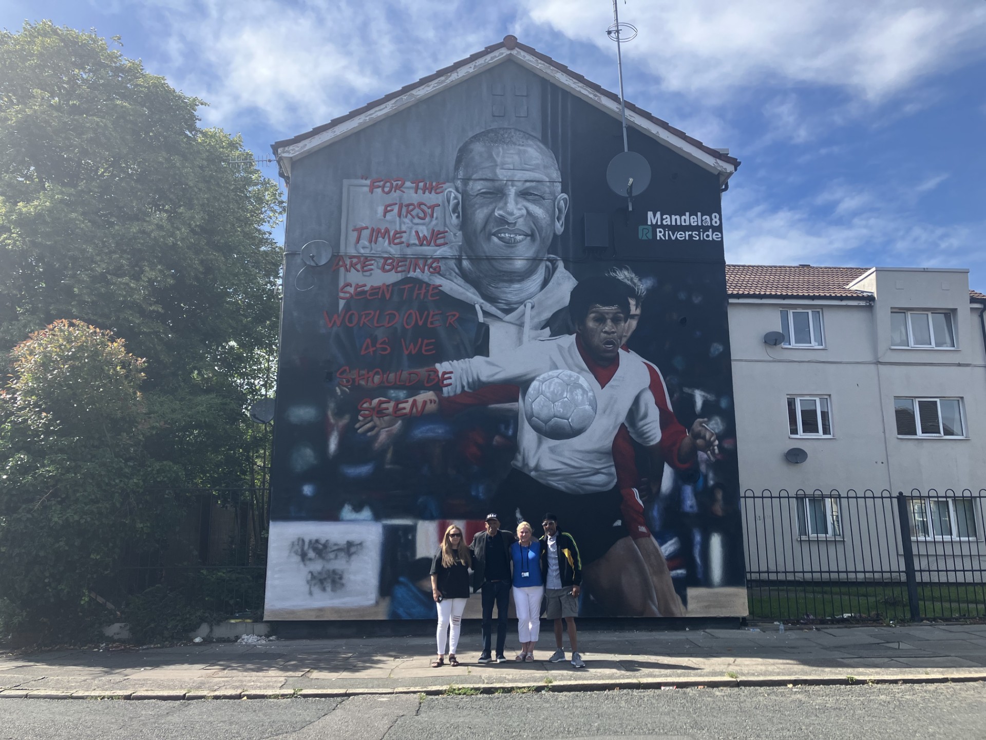 Liverpool's first black footballer honoured with mural in local community