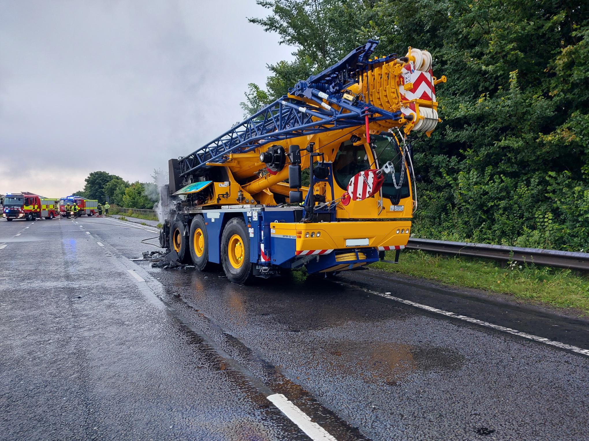 Recovery work underway after crane fire on A38
