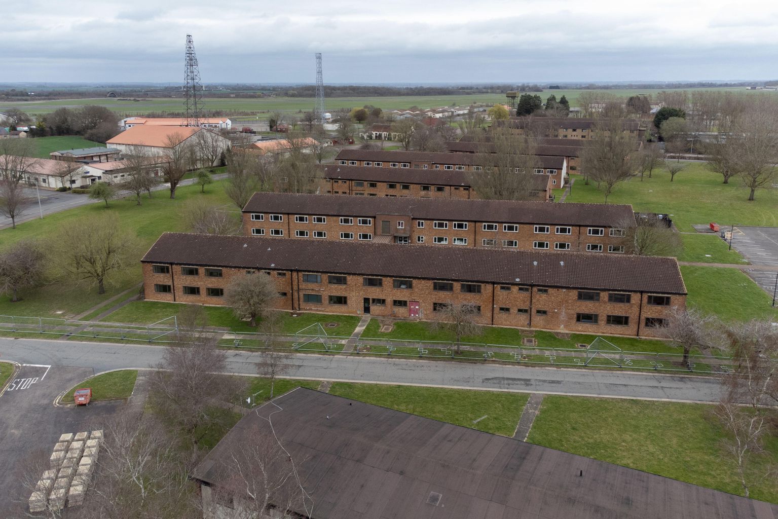 Asylum seekers wrongly housed at 'prison-like' former RAF base in Essex ...