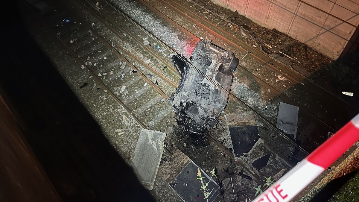 Major rail disruption after car smashes off bridge onto tracks