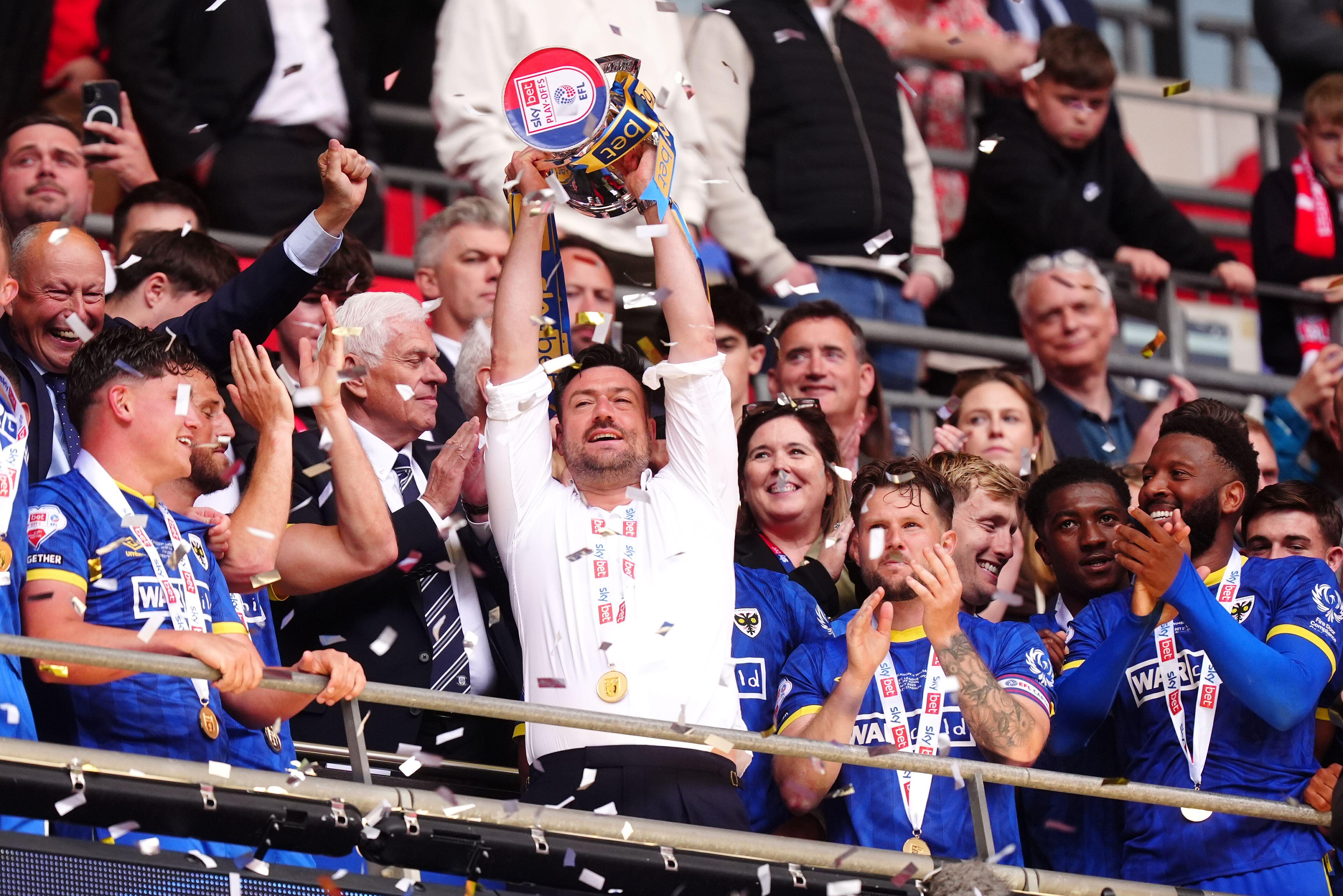 AFC Wimbledon secure promotion to League One with victory over Walsall