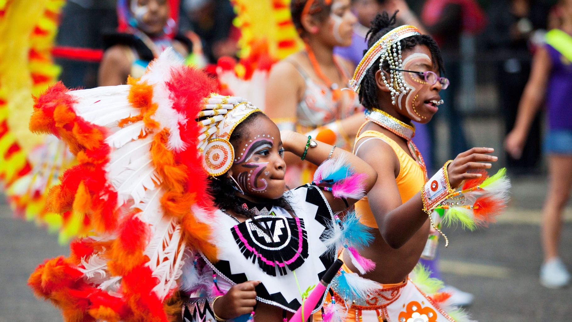 Notting Hill Carnival revellers squirt paint as part of colourful ...