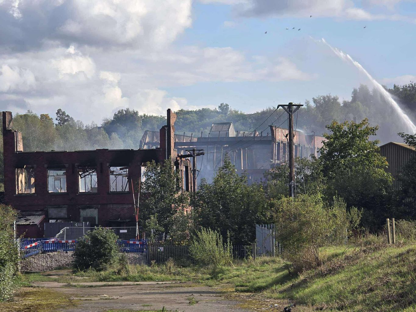MANCHESTER, ENGLAND FIREFIGHTER SERIOUSLY INJURED AT MILL FIRE ...