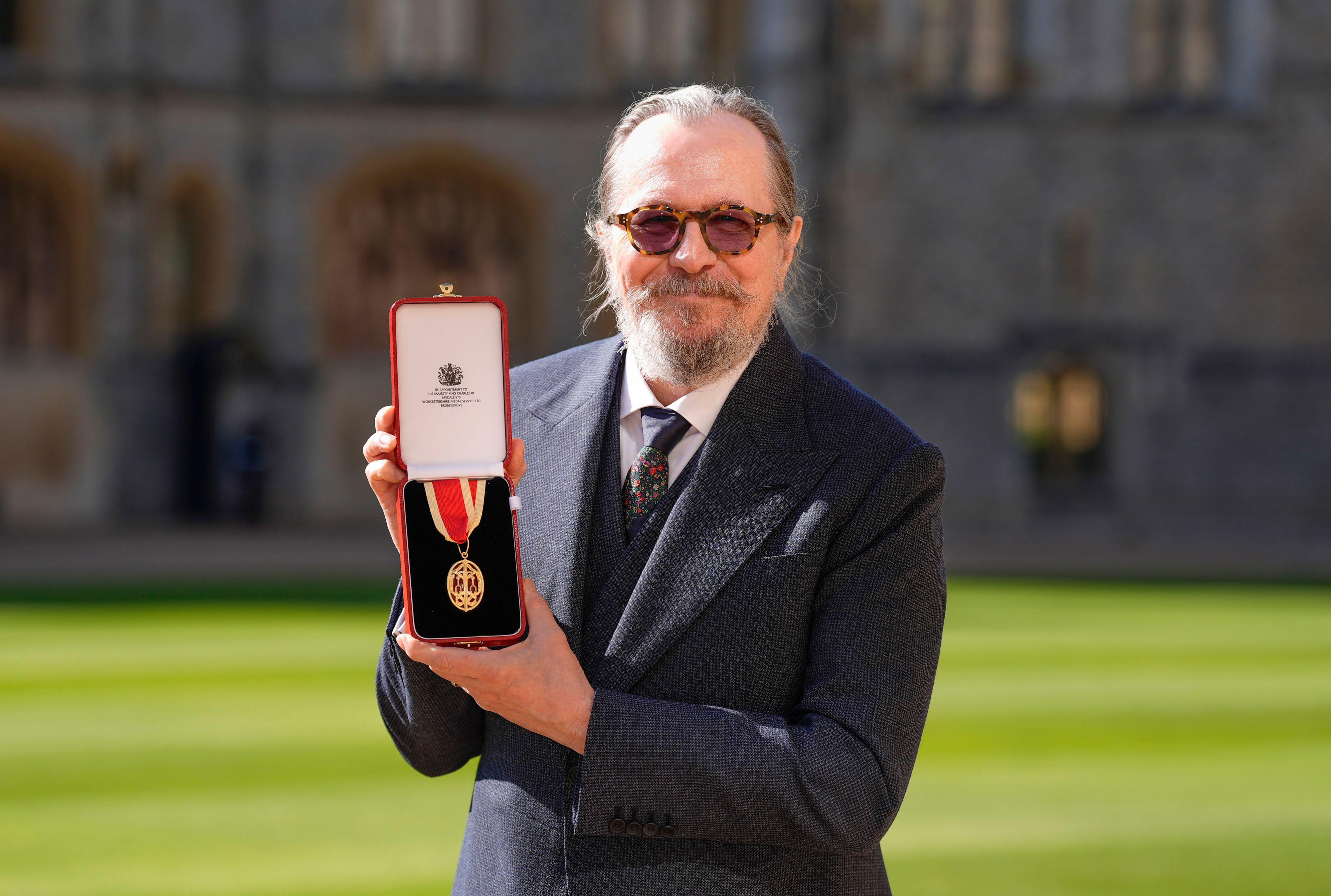 Gary Oldman knighted by Prince William