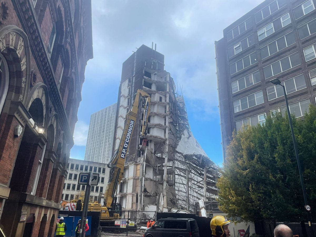 Firefighters at scene of Manchester demolition site after scaffolding ...