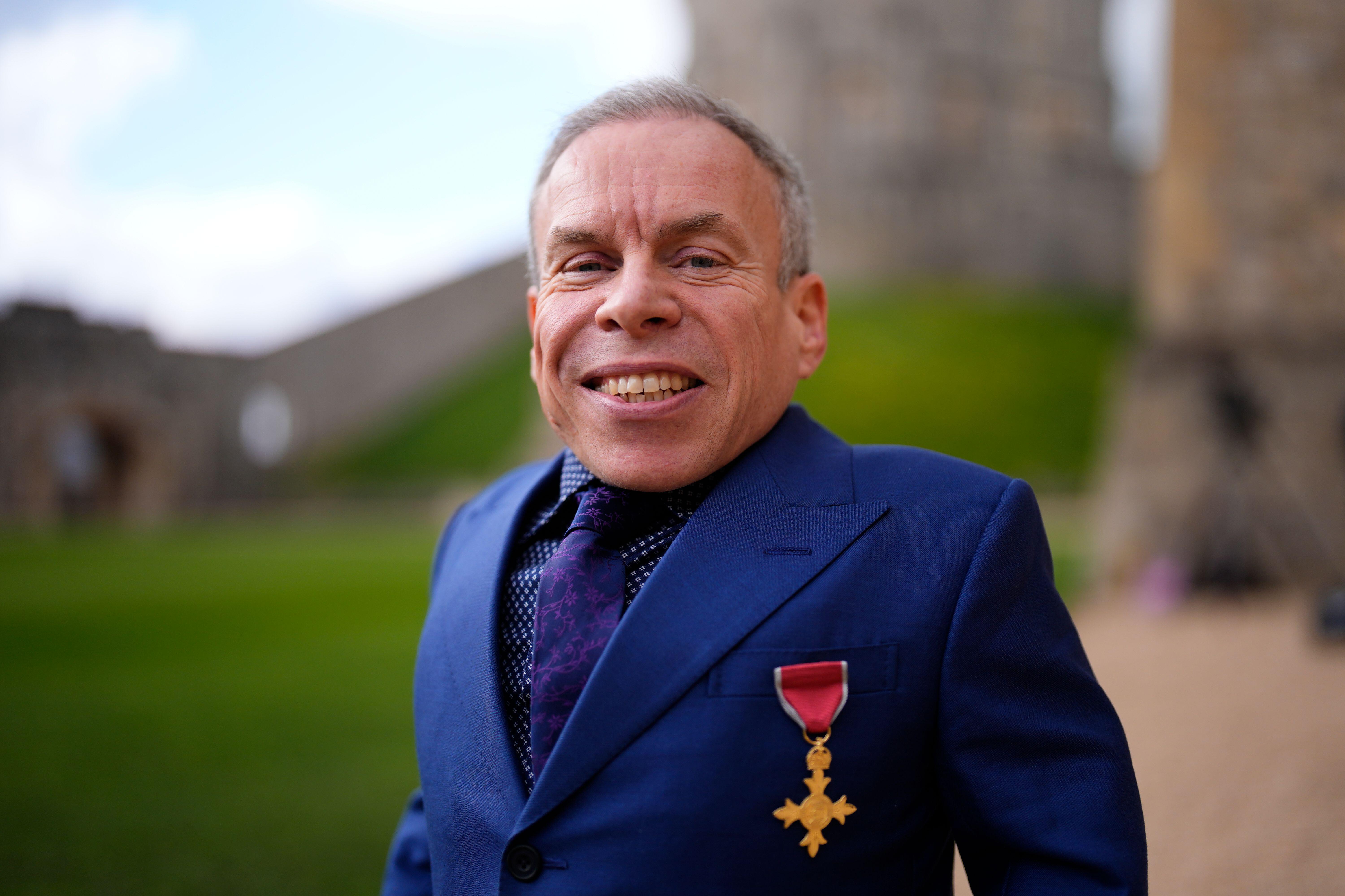 Actor Warwick Davis given OBE by Prince William