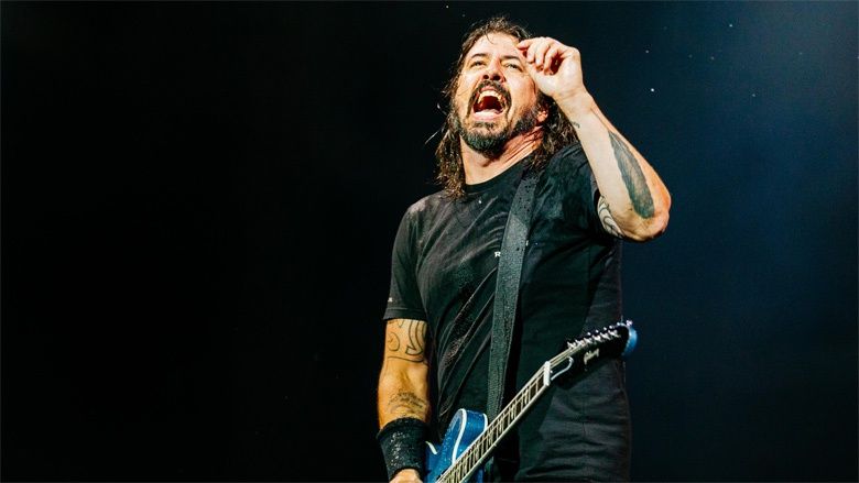 Watch Dave Grohl sing 'My Hero' with Swedish medic who treated his ...