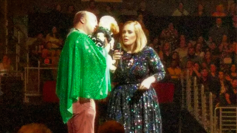 Next to join Adele on stage is... a dog wearing an Adele t-shirt ...